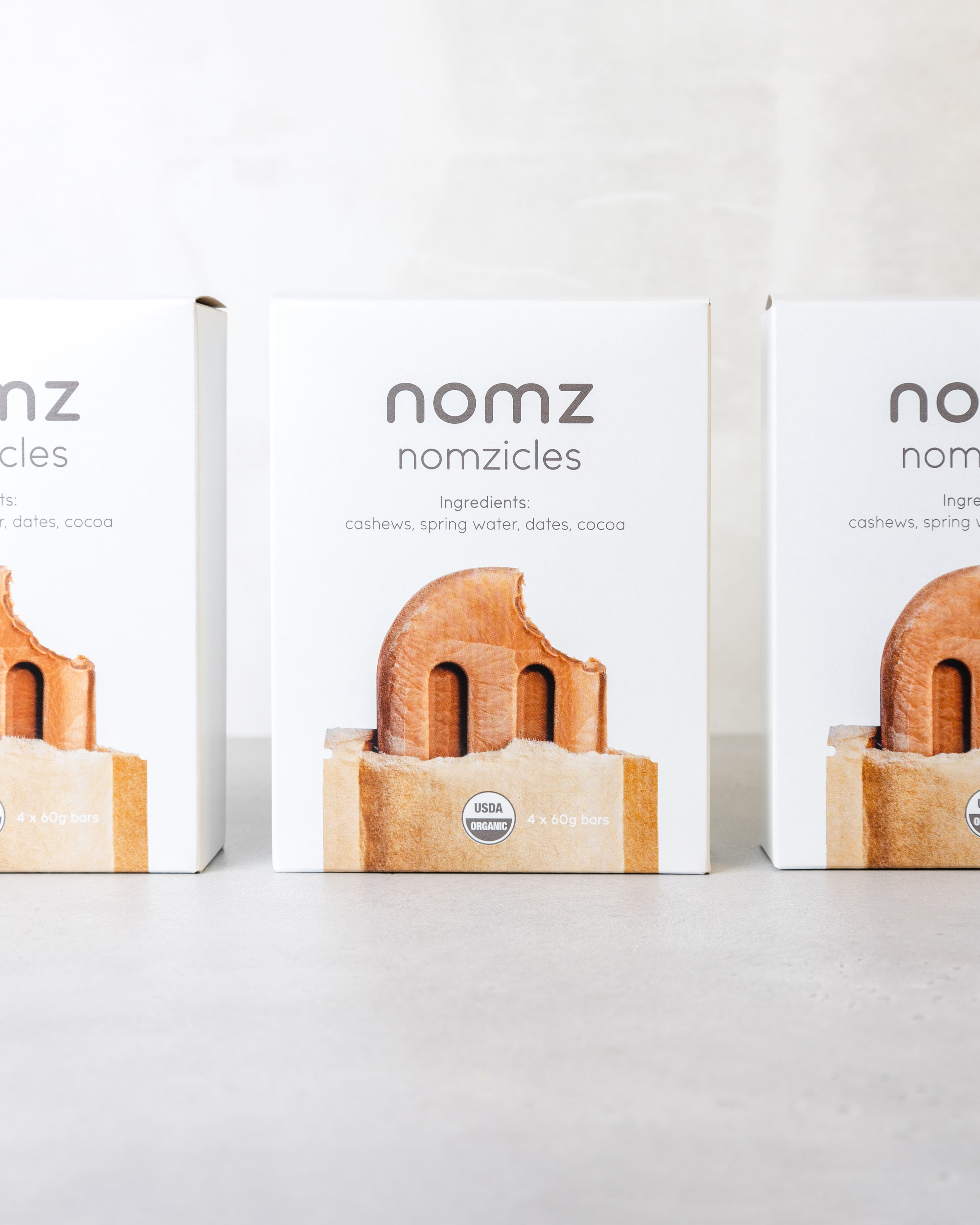 nomz: treat your body · organic snacks, superfoods, nut butters + more